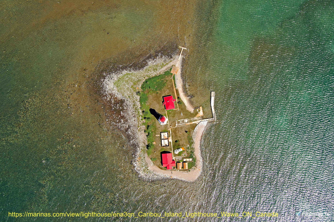 Caribou Island Lighthouse, buildings, and float plane dock, Ontario for ...